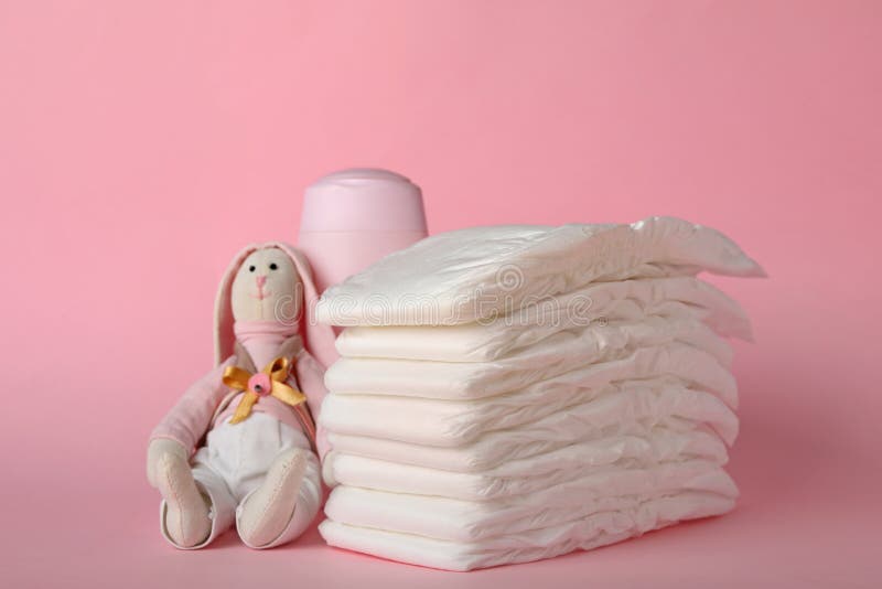 Diapers and Baby Accessories on Pink Background Stock Image - Image of ...