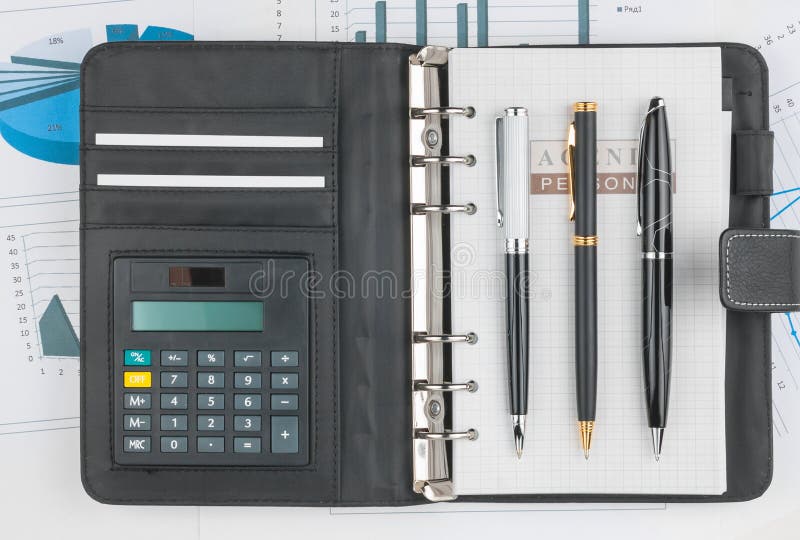 Calculator, the Diary and the Headset are on the Diagrams. Stock Photo ...