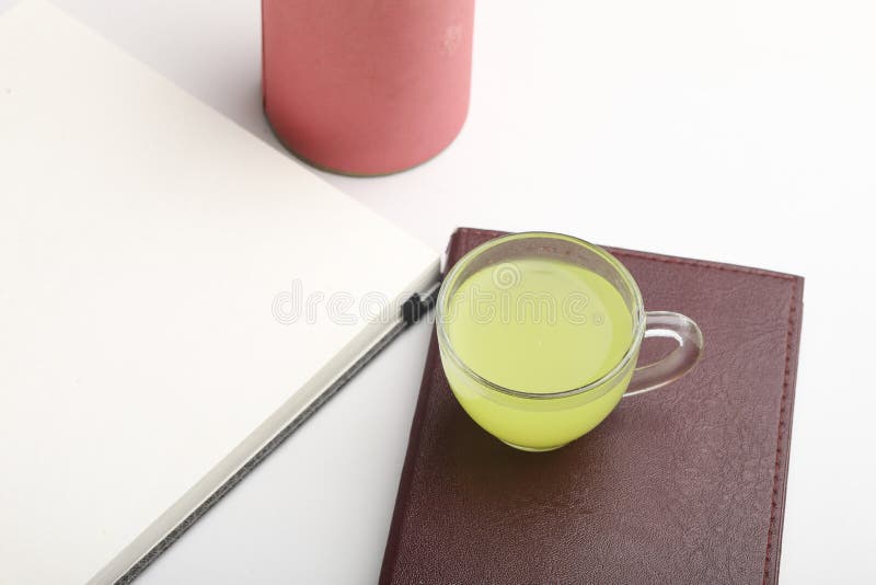 Diary and Pen with Cup of Green Tea. Work from Home Concept Stock Photo ...