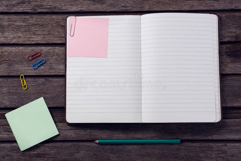 Diary, Sticky Notes, Pencil and Paper Clip on Wooden Table Stock Image ...