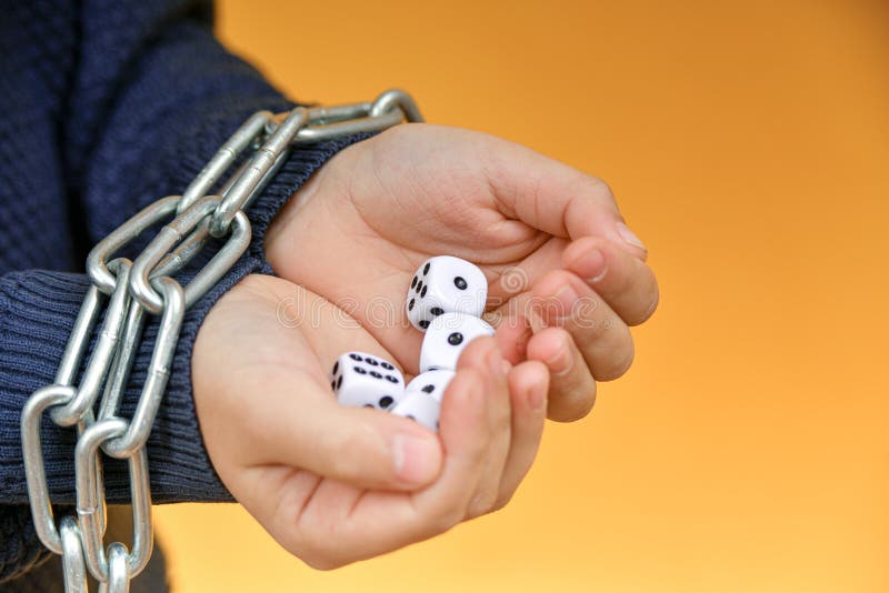 Dice in the Hands of a Person Whose Hands are Tied with a Chain ...