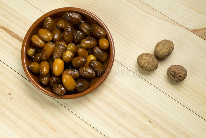 Dice and Nuts on a Background of Pine Wood. Stock Photo - Image of ...