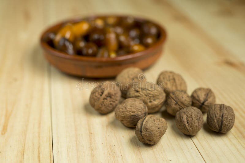 Dice and Nuts on a Background of Pine Wood. Stock Photo - Image of ...