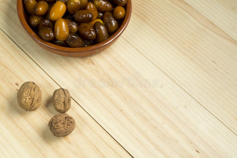 Dice and Nuts on a Background of Pine Wood. Stock Photo - Image of ...