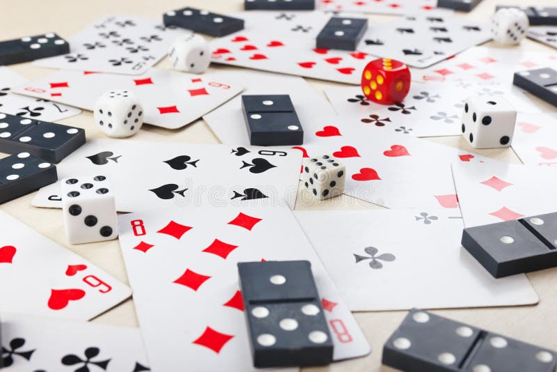 Playing Cards, Dominoes and Dice for Board Games on Table Close Up ...
