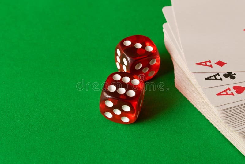 Dice and Playing Cards on the Green Table . Game Concept Stock Image ...