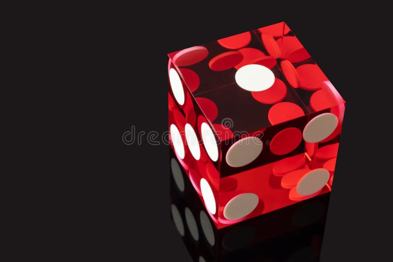 Dice Red with Sharp Edges Close-up with Copy Space. One, with ...
