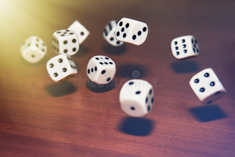 Thrown Dice Bouncing Across A White Surface Stock Image - Image of ...