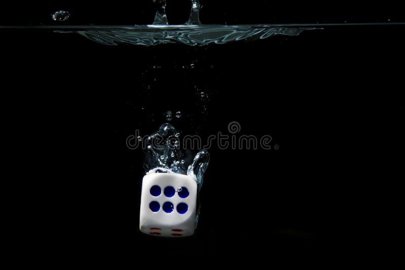 Dice with the Number Six Face in the Water with Black Background Stock ...