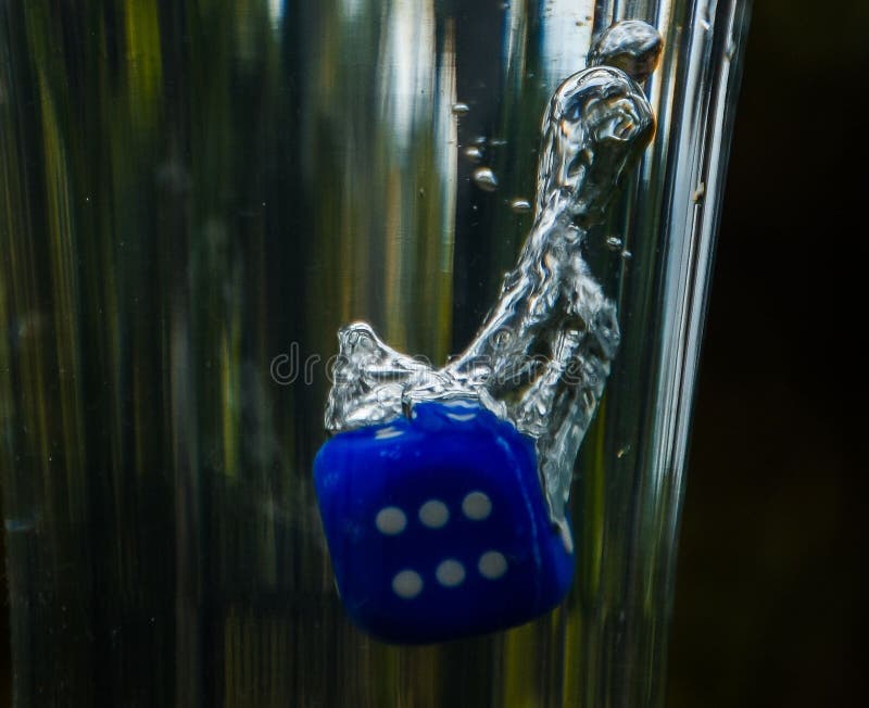 Dice in water . Splash . stock image. Image of yellow - 193073835