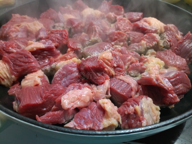 Diced Beef Cooking in an Iron Cast Pan Stock Image - Image of rising ...