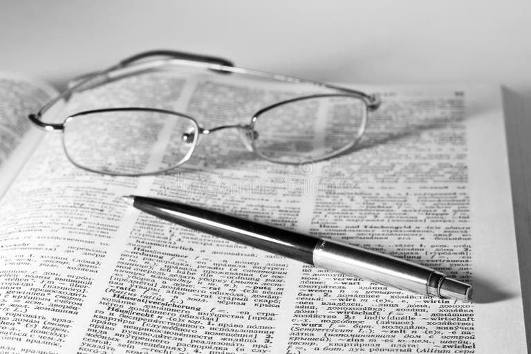 Dictionary with a Pair of Glasses and Pen Stock Image - Image of school ...