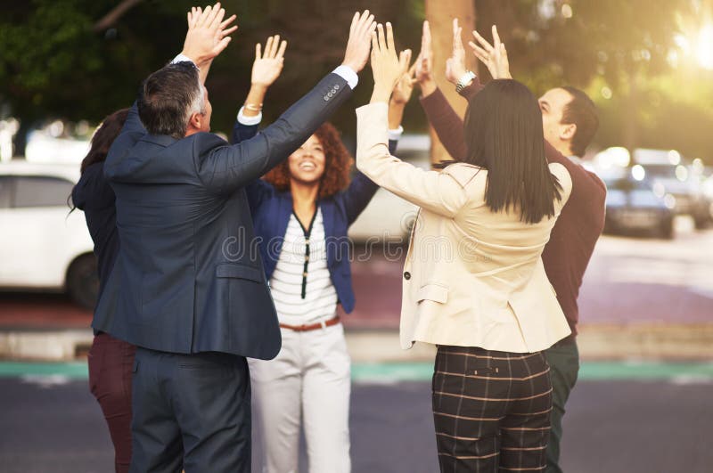 We Did it. a Group of Colleagues High Fiving Outside. Stock Image ...