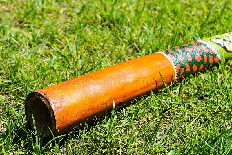 Didgeridoo on the grass stock photo. Image of australia - 94220226
