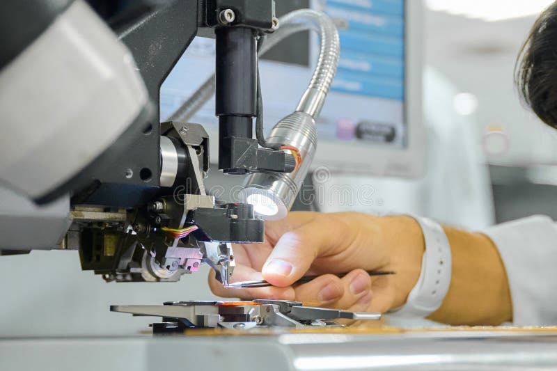 Die Bonding Machine in Operation with Skilled Technician Performing ...