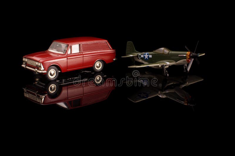 Die Cast Model Car and Model Plane on the Black Reflective Surface ...