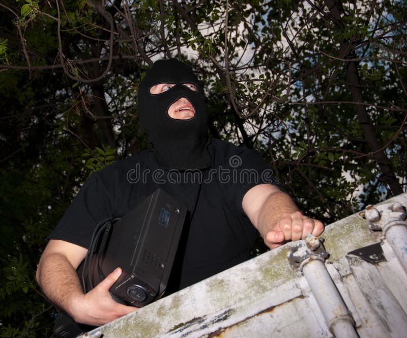 Dief in een masker stock afbeelding. Image of kaukasisch - 9495067