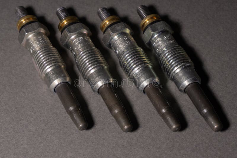 Diesel Engine Glow Plug on a Gray Background. Replaceable Part of a ...