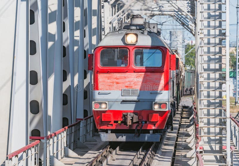 Diesel freight train moves stock image. Image of bridge - 196553019