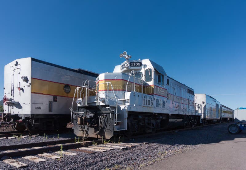 Diesel Train Engine with White and Golden Color on the Blue Sky in ...