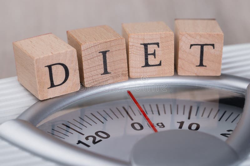Diet Blocks Arranged on Weight Scale Stock Image - Image of metallic ...