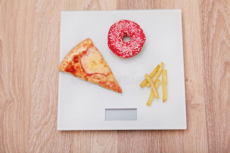 Diet, Fast Food on Scale. Unhealthy Junk Food. Obesity. Stock Photo ...