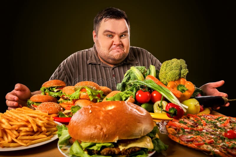 Diet Fat Man Makes Choice Between Healthy And Unhealthy Food Stock