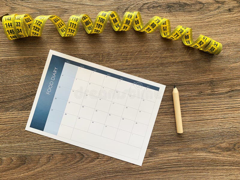 Diet Plan Concept. Measuring Tape and Diet Plan on Wooden Background ...