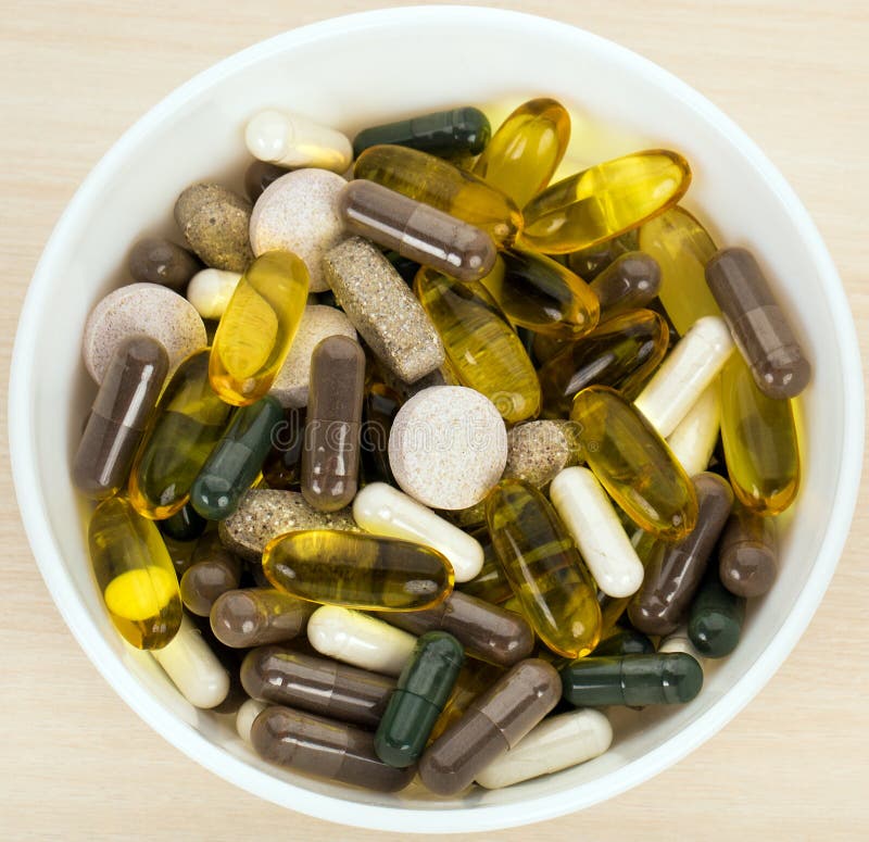 Dietary Supplement Capsules and Tablets in Bowl Stock Photo - Image of ...