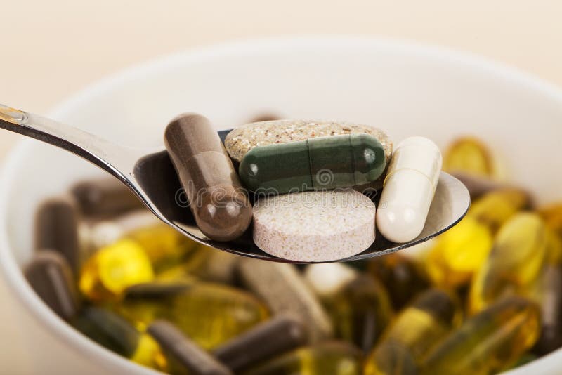 Dietary Supplement Capsules and Tablets in Spoon Stock Photo - Image of ...