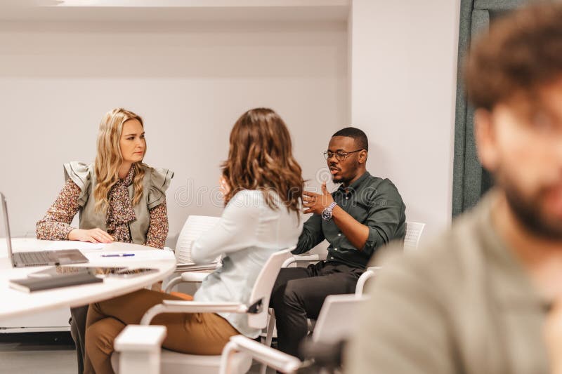 Multiracial, Inter-generational Coworkers Learning Together at Modern ...