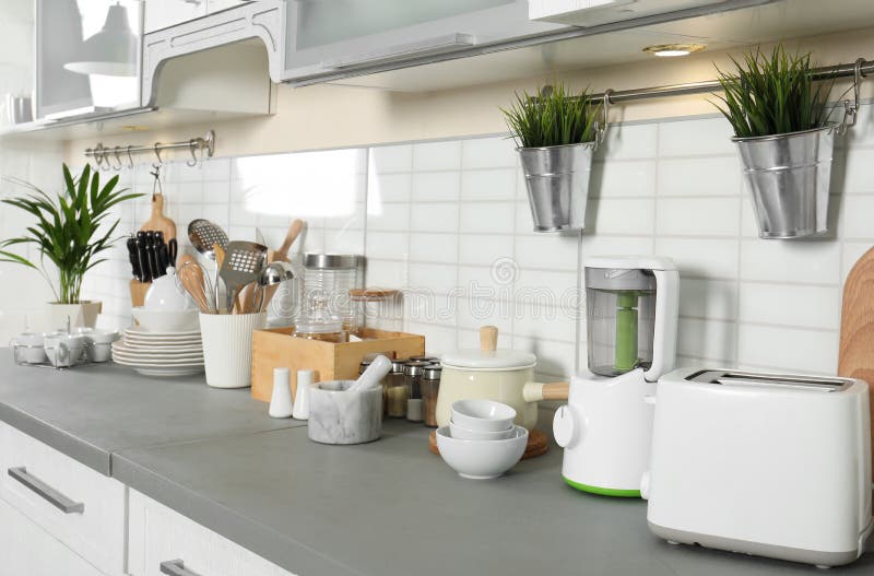 Different Appliances, Clean Dishes on Kitchen Counter Stock Image ...