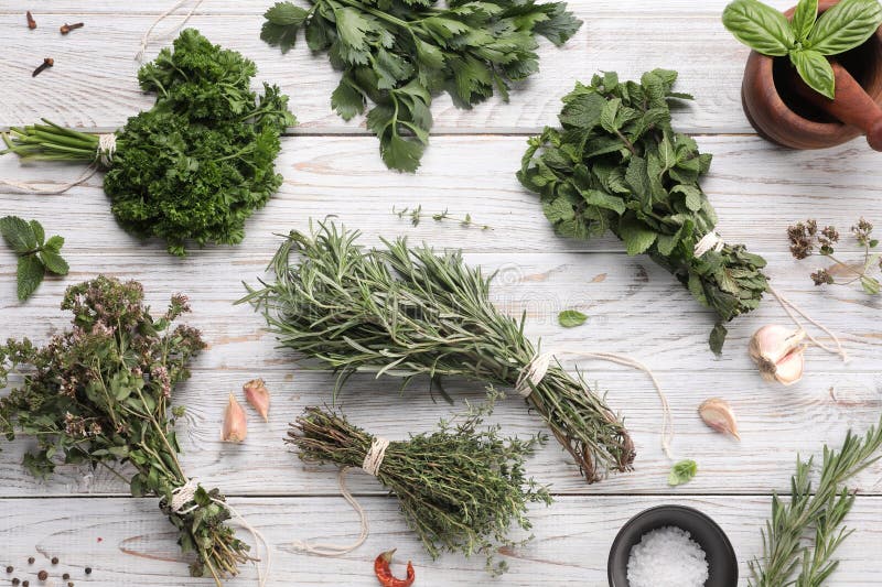 Different Aromatic Herbs on White Wooden Table, Flat Lay Stock Photo ...