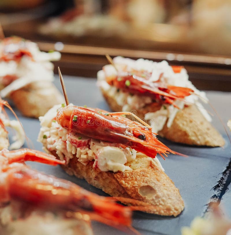 Different Assorted Canapes of Bread with Crab, Ham and Vegetables Stock ...