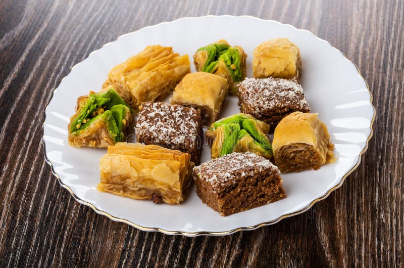 Different Baklava in White Plate on Wooden Table Stock Image - Image of ...