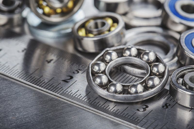 Different Bearings, Vernier Caliper and Ruler on Metal Background. Part ...