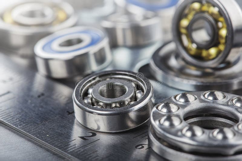 Different Bearings, Vernier Caliper and Ruler on Metal Background. Part ...