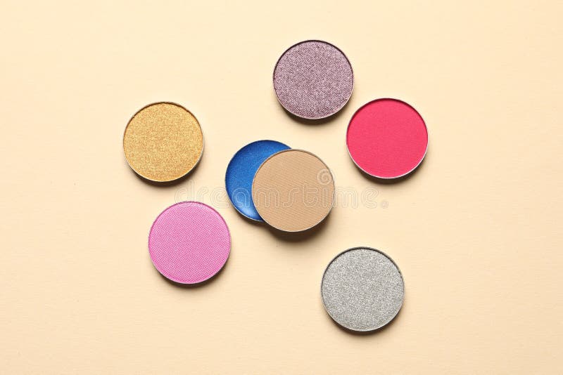 Different Beautiful Eye Shadows on Beige Background, Flat Lay Stock ...