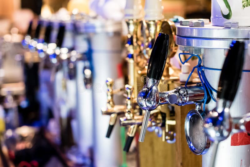 Beer pumps in a row stock photo. Image of people, nightlife - 49008528
