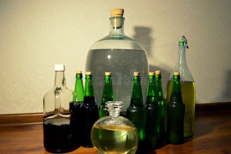 Bottles with Different Liquids Stock Image - Image of colored, bottles ...