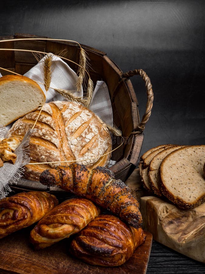 Different Bread, Buns in Basket on Concrete Background, Copy Space ...