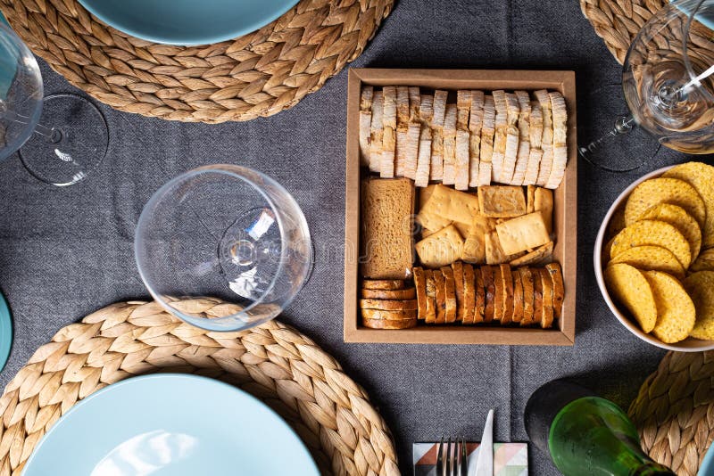 Different Bread Toast on a Box on a Served Dining Table with Blue ...