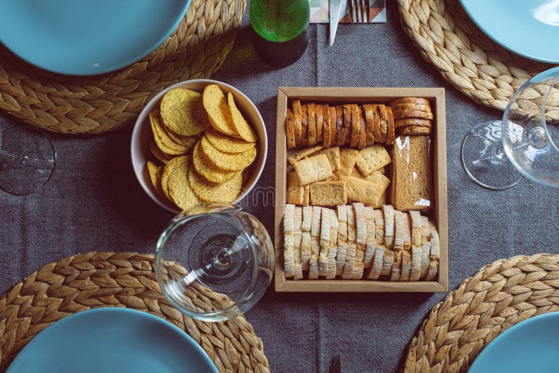 Different Bread Toast on a Box on a Served Dining Table with Blue ...