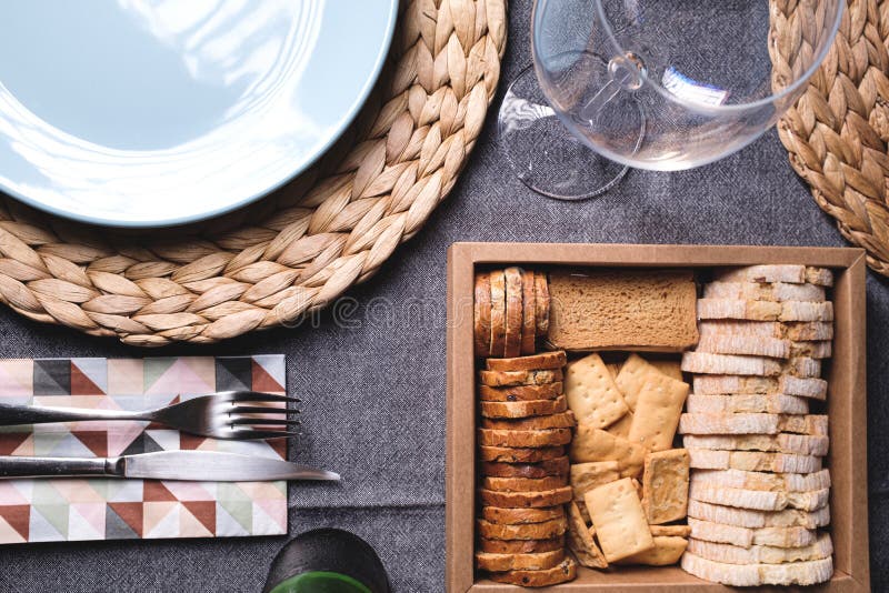Different Bread Toast on a Box on a Served Dining Table with Blue ...