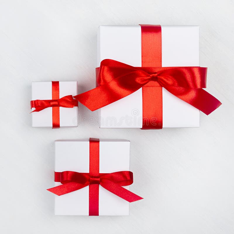 Different Bright Simple White Gift Box with Red Silk Ribbon on White ...