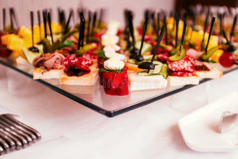 Different Canape with Meat, Cheese and Pickles on a Buffet Dinner ...