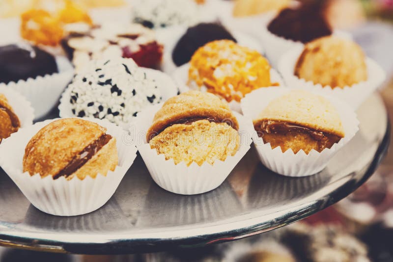 Different Candies, Cookies and Biscuits on Banquet Table. Stock Image ...