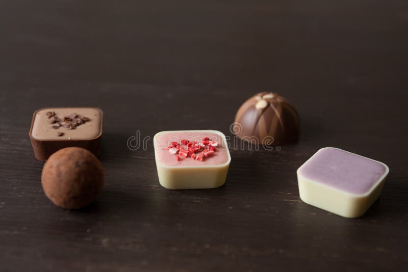 Different Candies on a Wooden Table. Stock Photo - Image of dark, brown ...