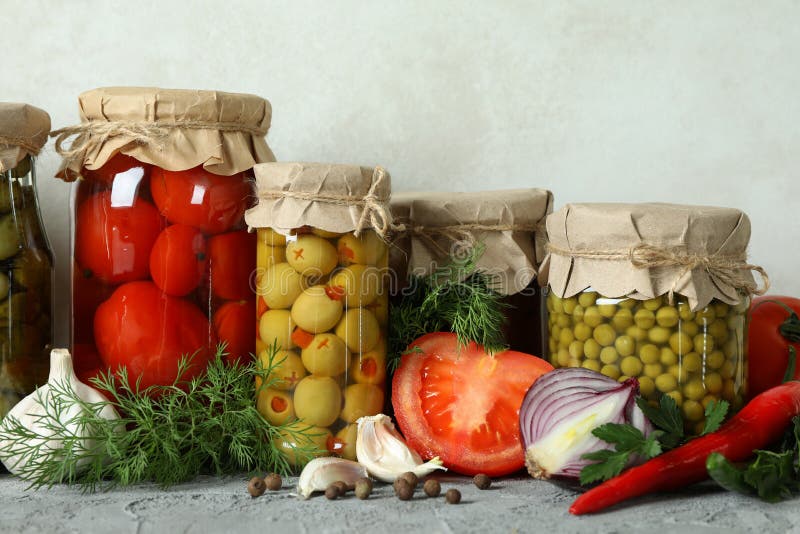 Different Canned Food and Ingredients on Gray Table Stock Image - Image ...