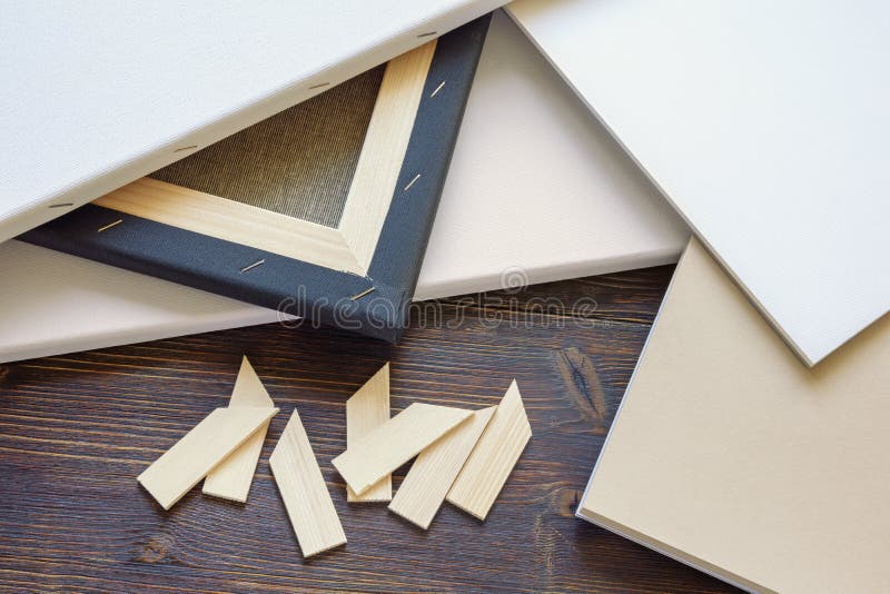 Different Canvases and Drawing Paper on a Rustic Table Stock Photo ...